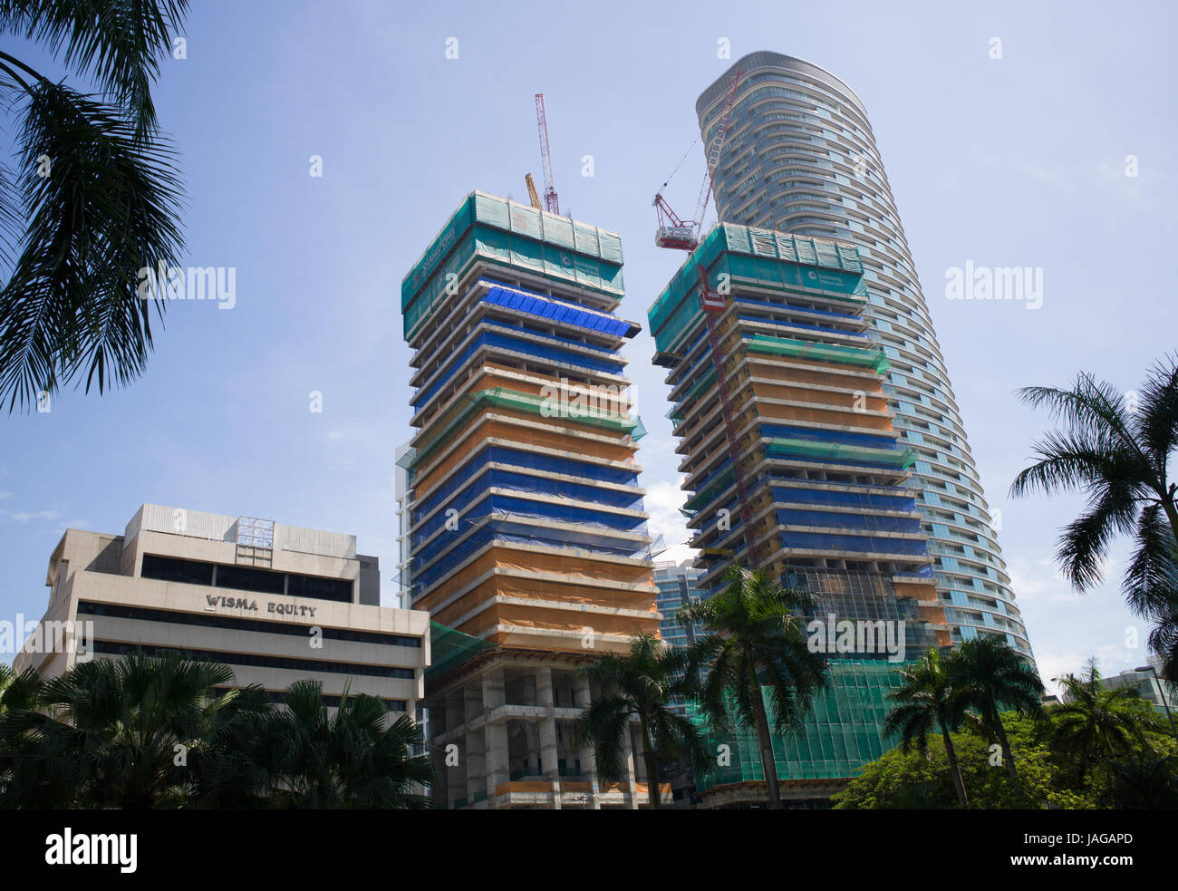 Multi coloured scaffolding netting around high rise buildings under ...