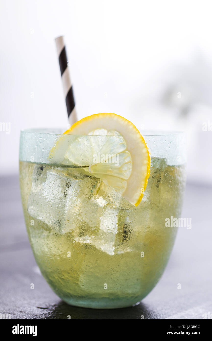 Cold Lemonade With Ice Cubes and Lemon on Dark Background Stock Photo ...