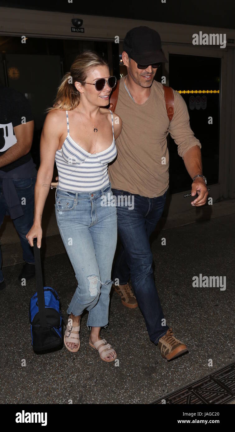 LeAnn Rimes with her husband Eddie Cibrian at Los Angeles International ...