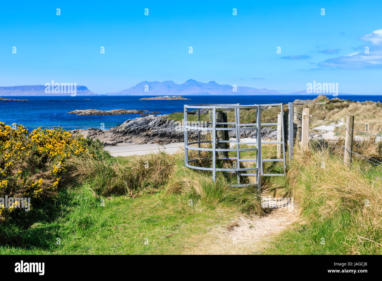 Path to beach at Camusdarach with views of Eigg and Rum in the distance ...
