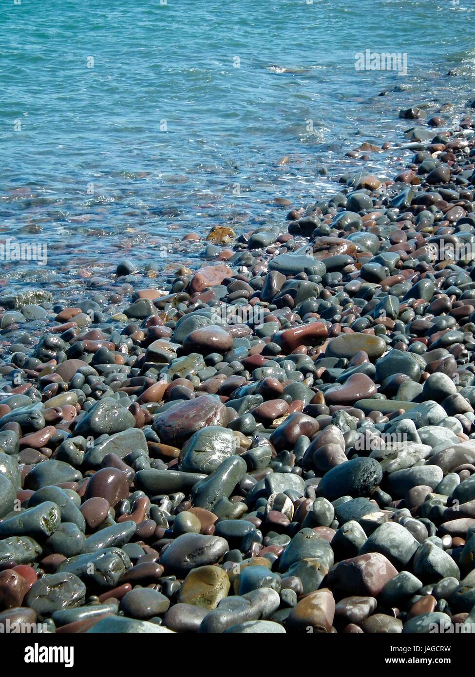 Wet Beach Pebbles and Turquoise Blue Water, Clovelly North Devon, UK ...