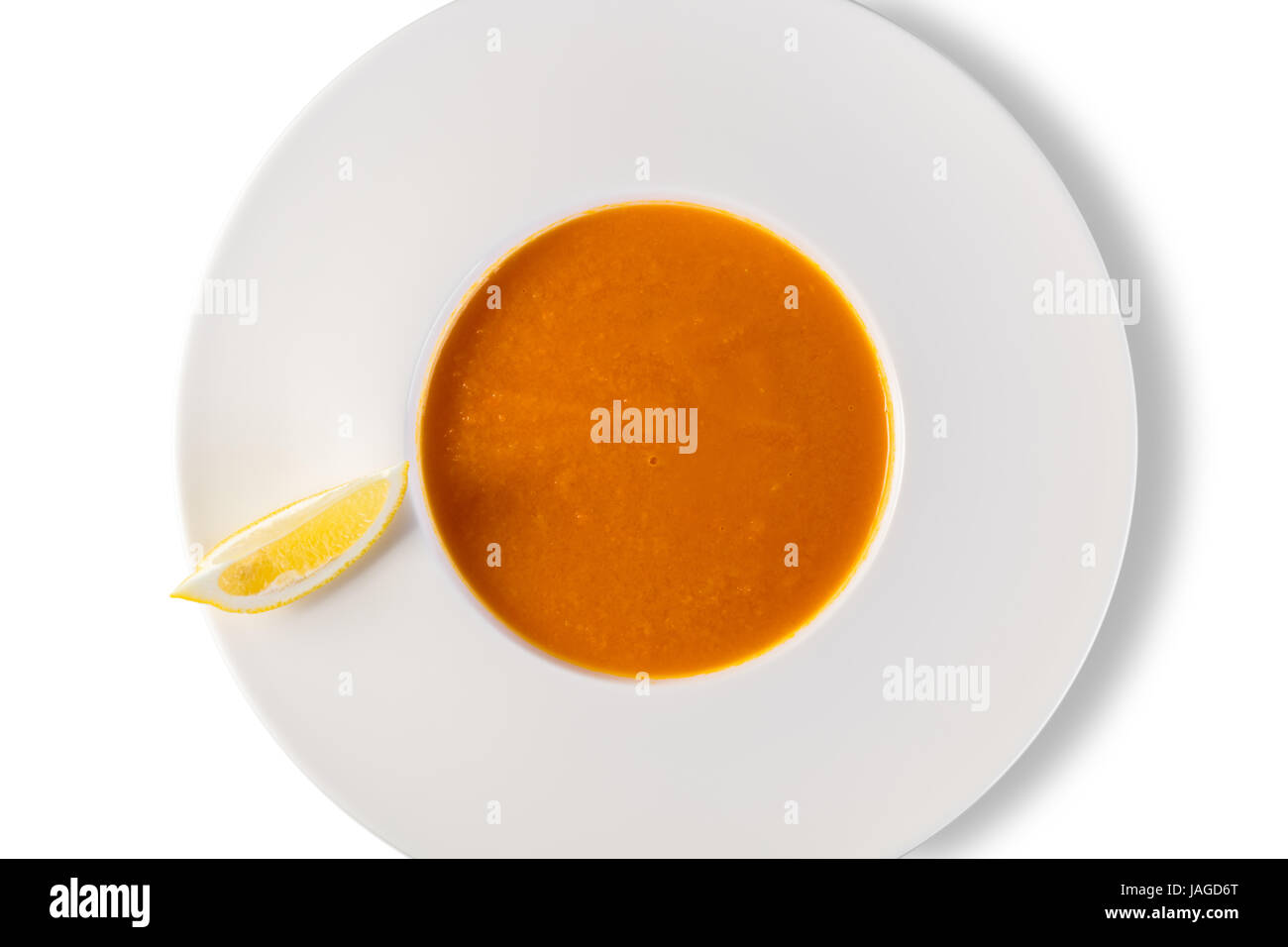 Carrot cream soup puree on white background Stock Photo - Alamy