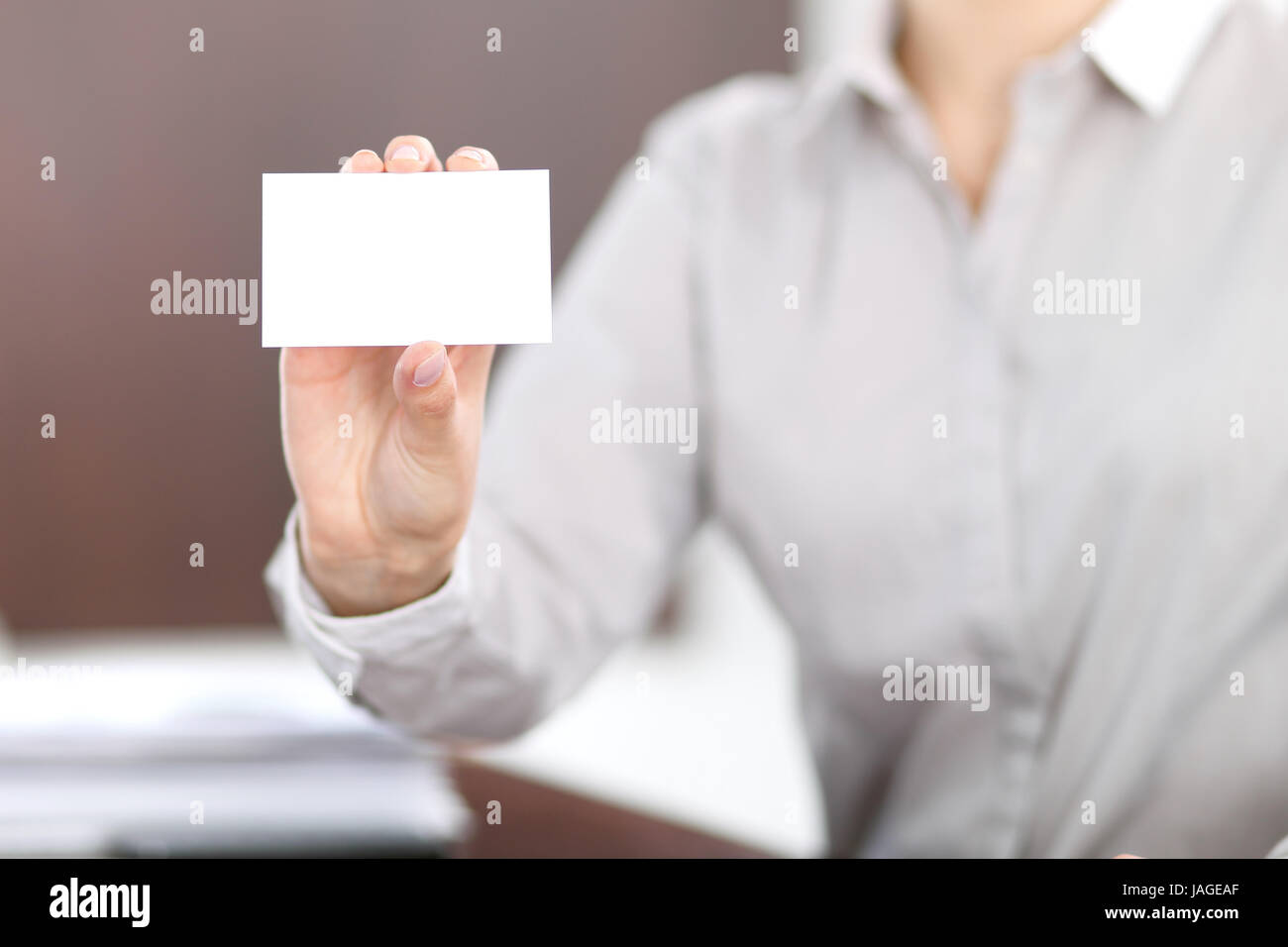 Business woman giving visit card Stock Photo - Alamy