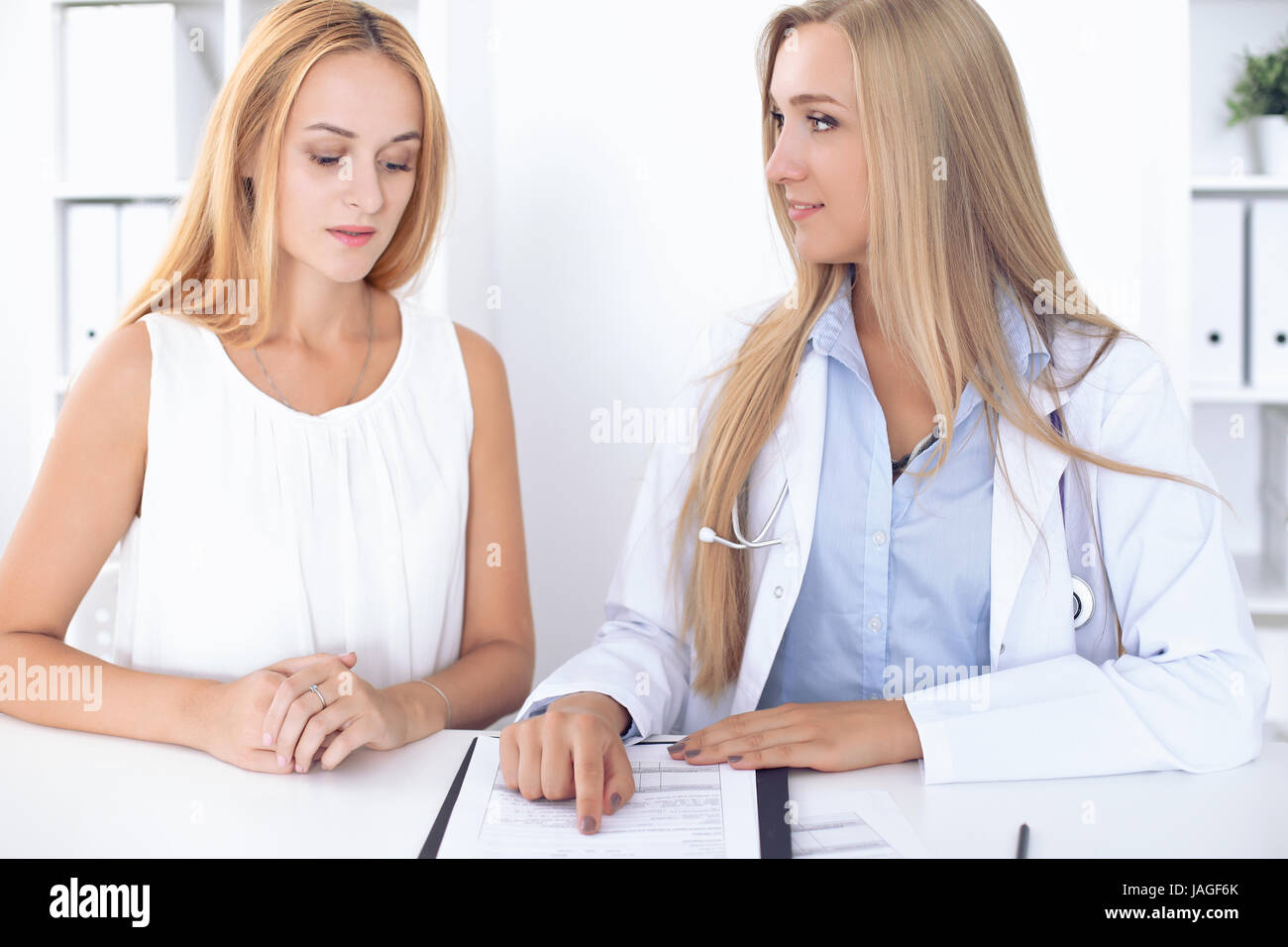 Doctor with patient in hospital Stock Photo - Alamy