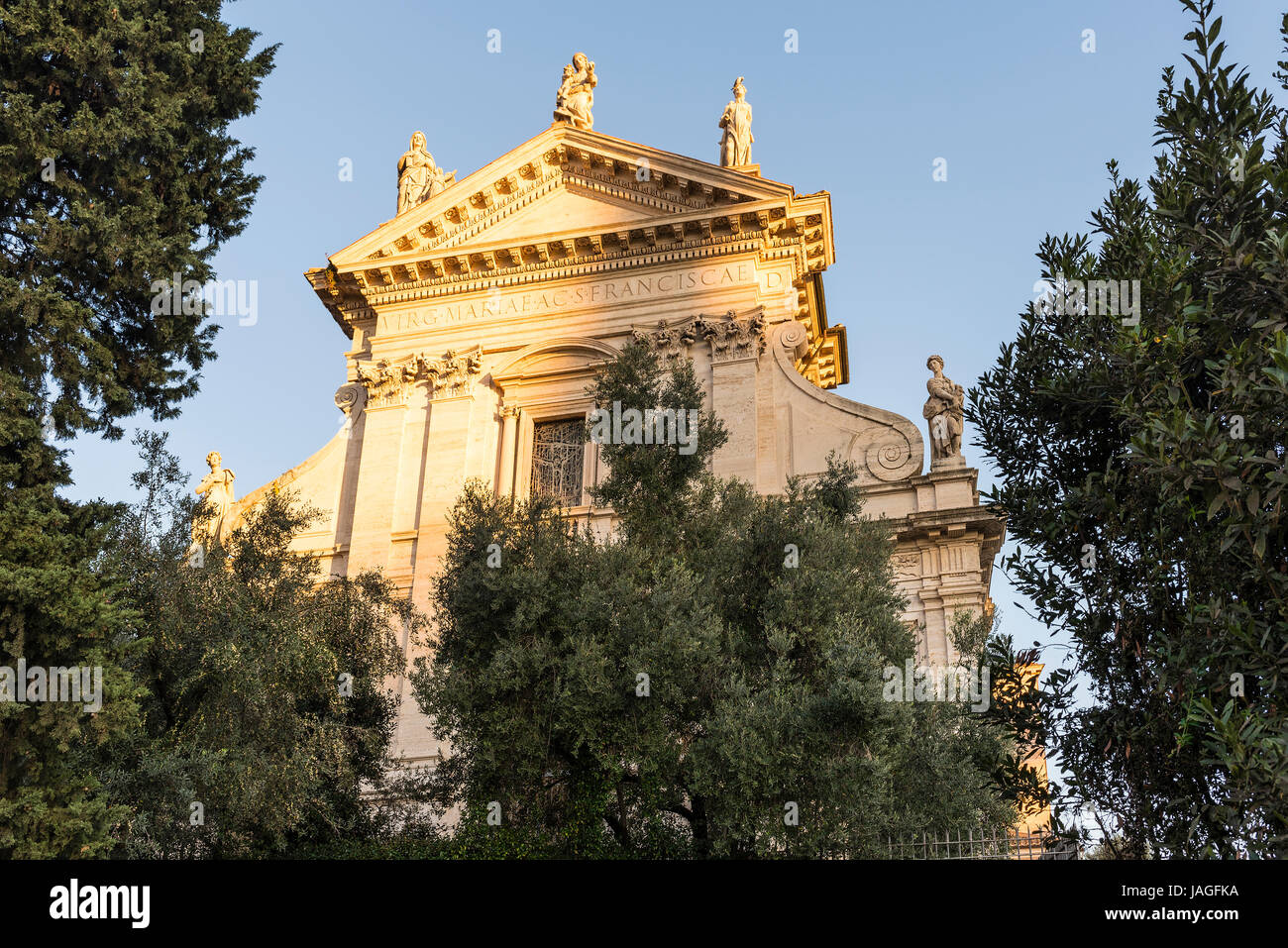 View of building with five statues at sunset, the Roman Forum, Rome ...