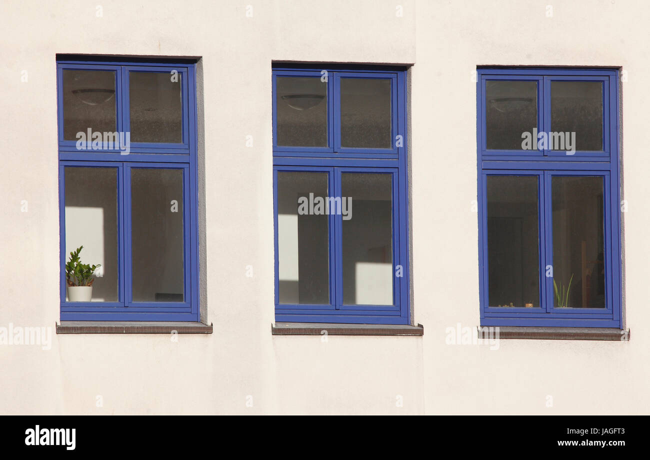 white house wall with blue windows Stock Photo - Alamy