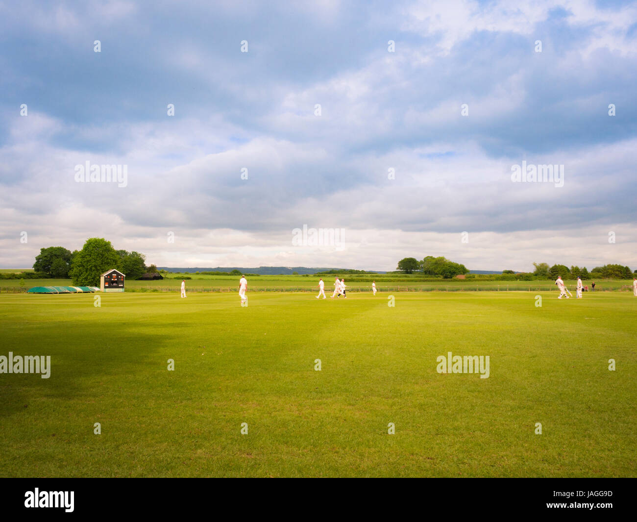 Game of Cricket being played in typical British village of Sessay with ...