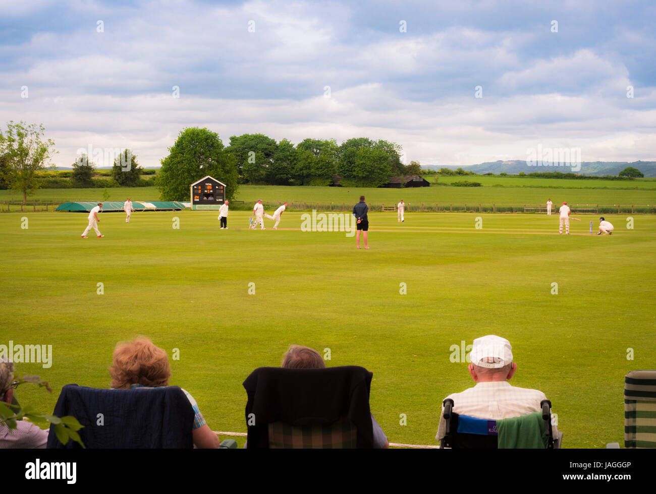 Game of Cricket being played in typical British village Stock Photo - Alamy