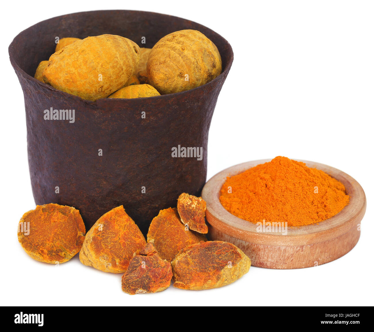 Turmeric in a vintage bowl over white background Stock Photo - Alamy
