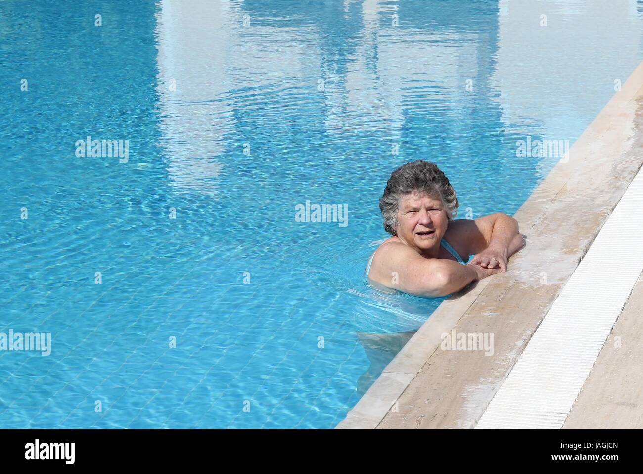 Older woman swimming hi-res stock photography and images - Alamy