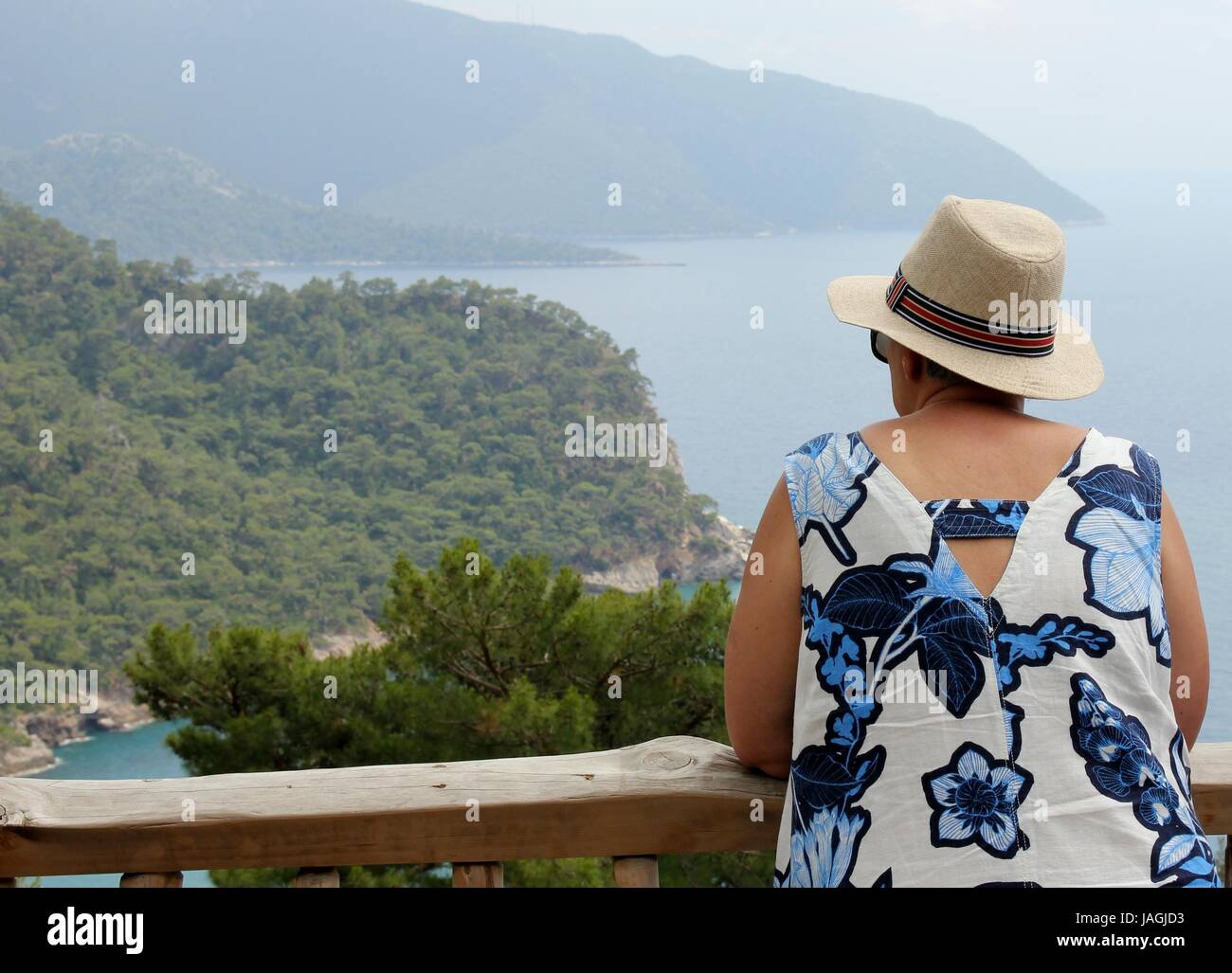 An english tourist looking out over the beautiful scenic bay at Kabak ...