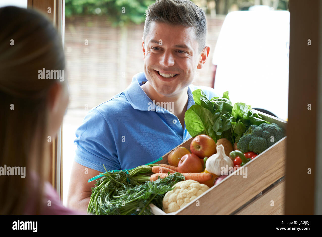 Man Making Home Delivery Of Organic Vegetable Box Stock Photo - Alamy