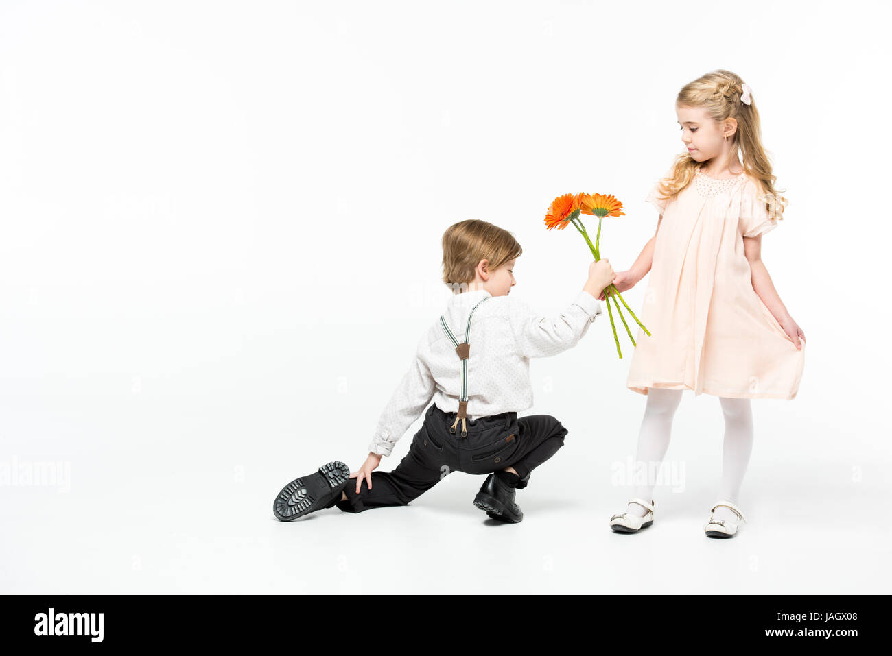 Girl giving boy flowers hi-res stock photography and images - Alamy