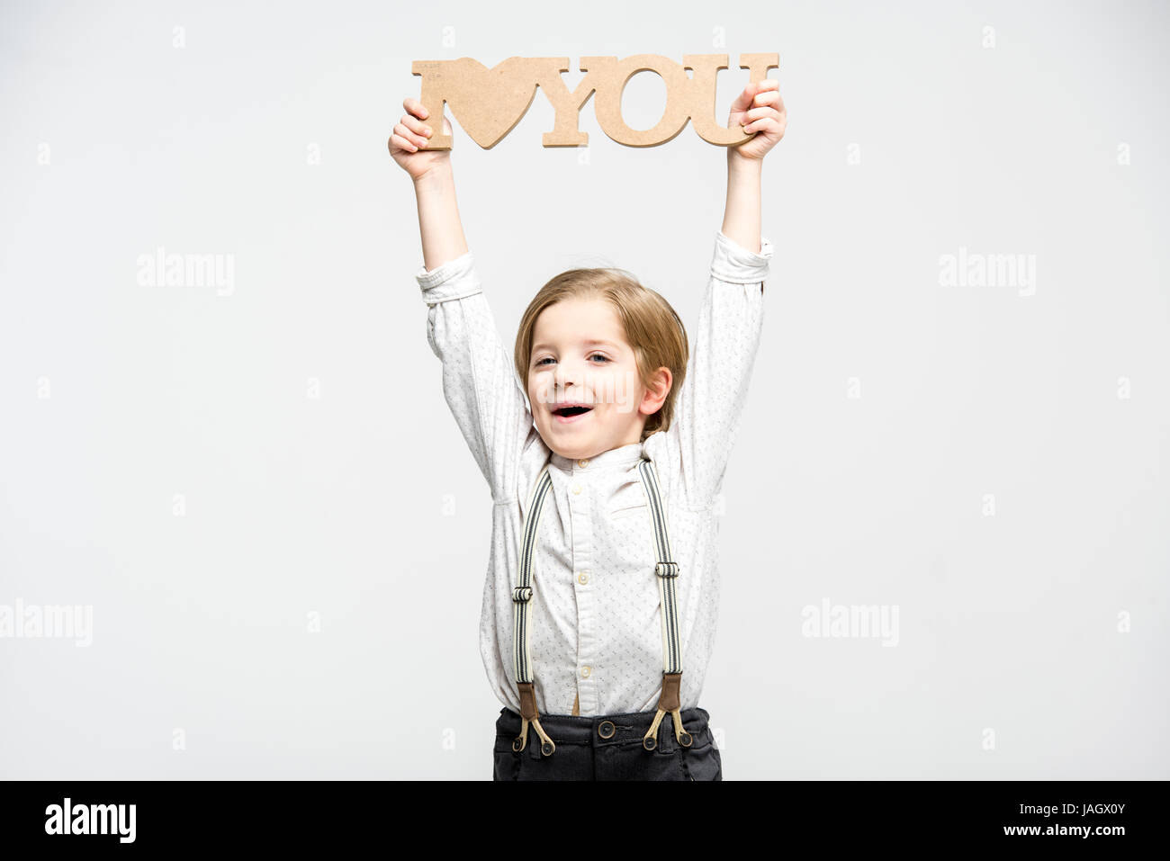 Boy holding wooden words Stock Photo - Alamy