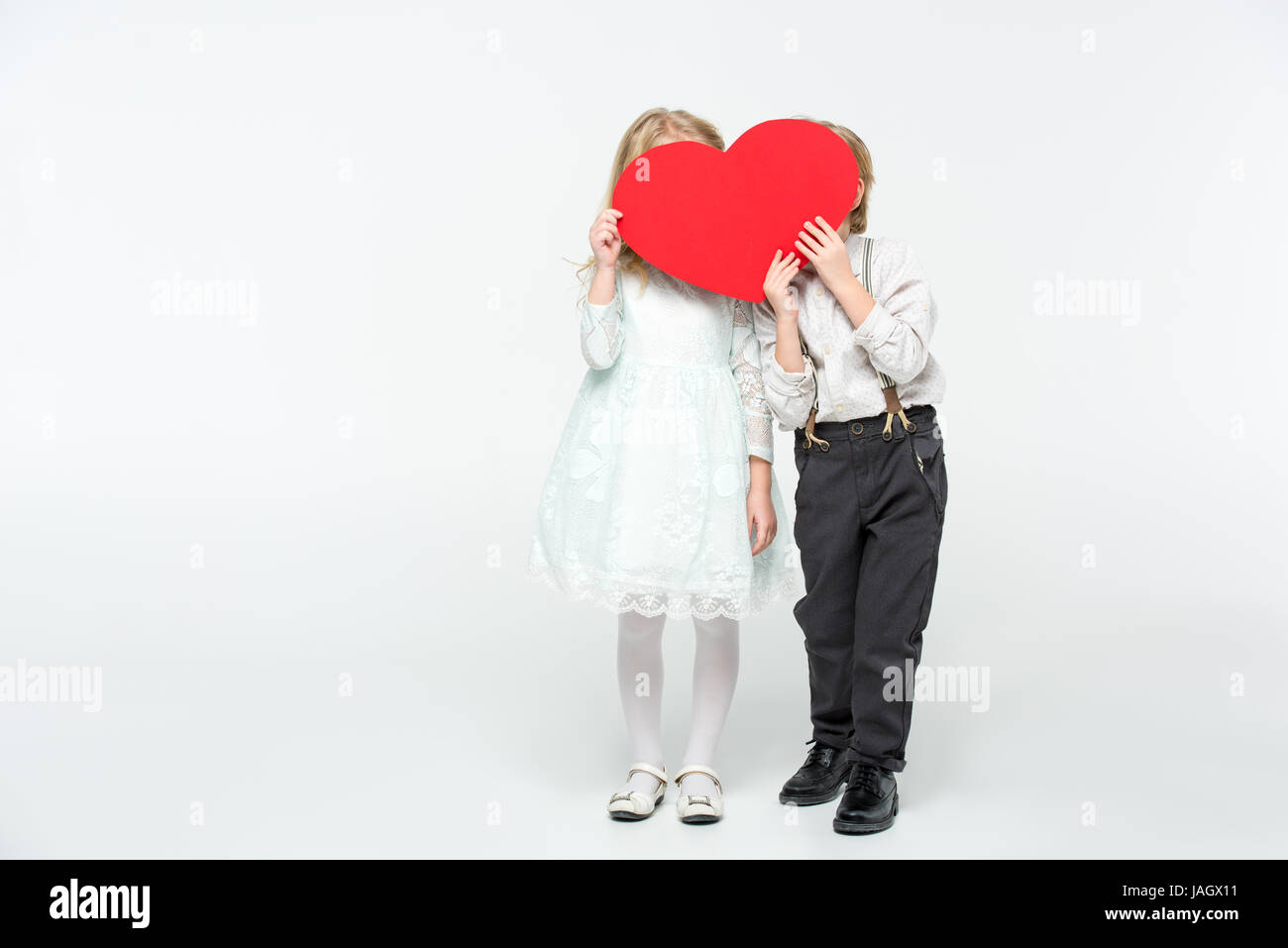 Kids holding red heart Stock Photo - Alamy