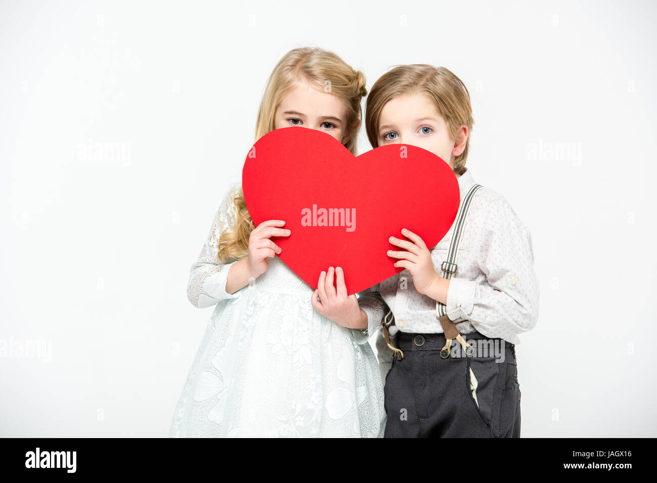 Kids holding red heart Stock Photo - Alamy