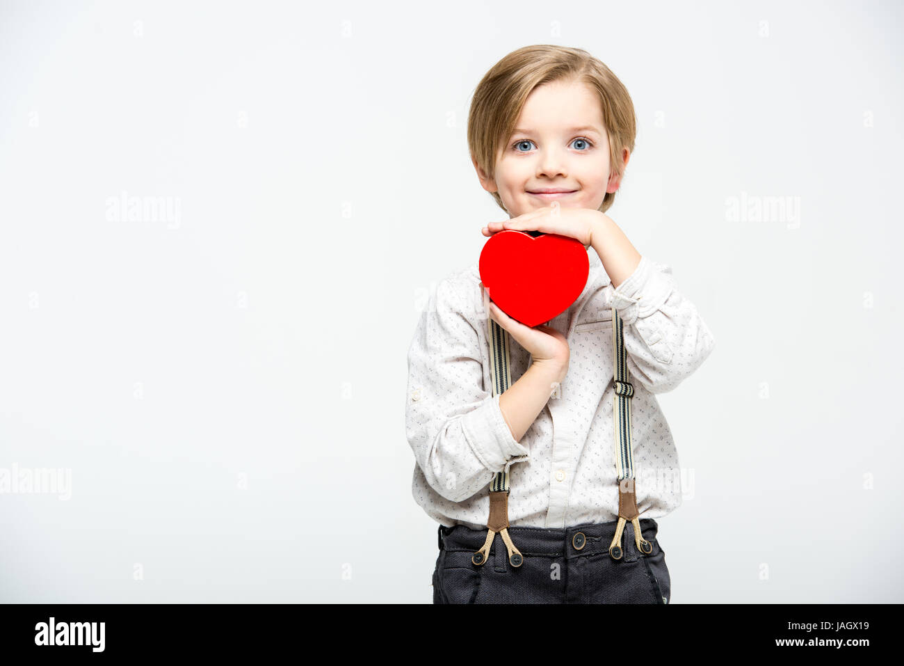 Boy with heart sign Stock Photo - Alamy
