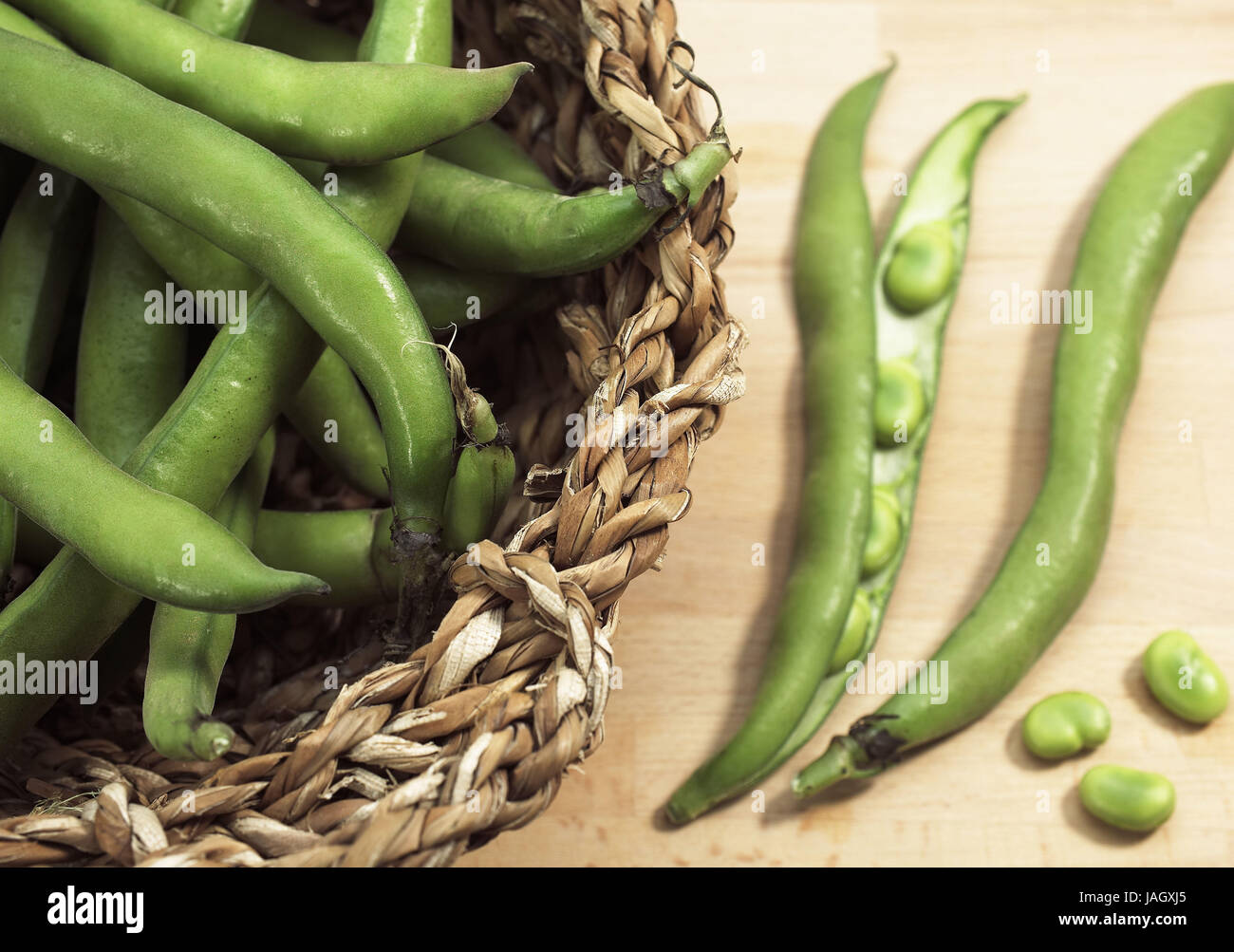 Fresh field beans,basket,wooden springboard Stock Photo - Alamy
