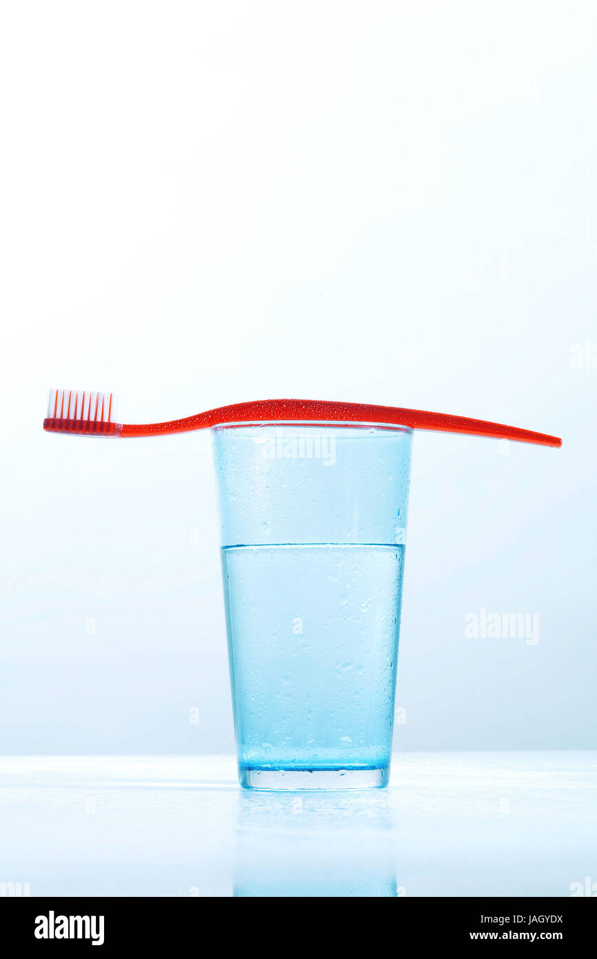 Toothbrush with glass Stock Photo - Alamy