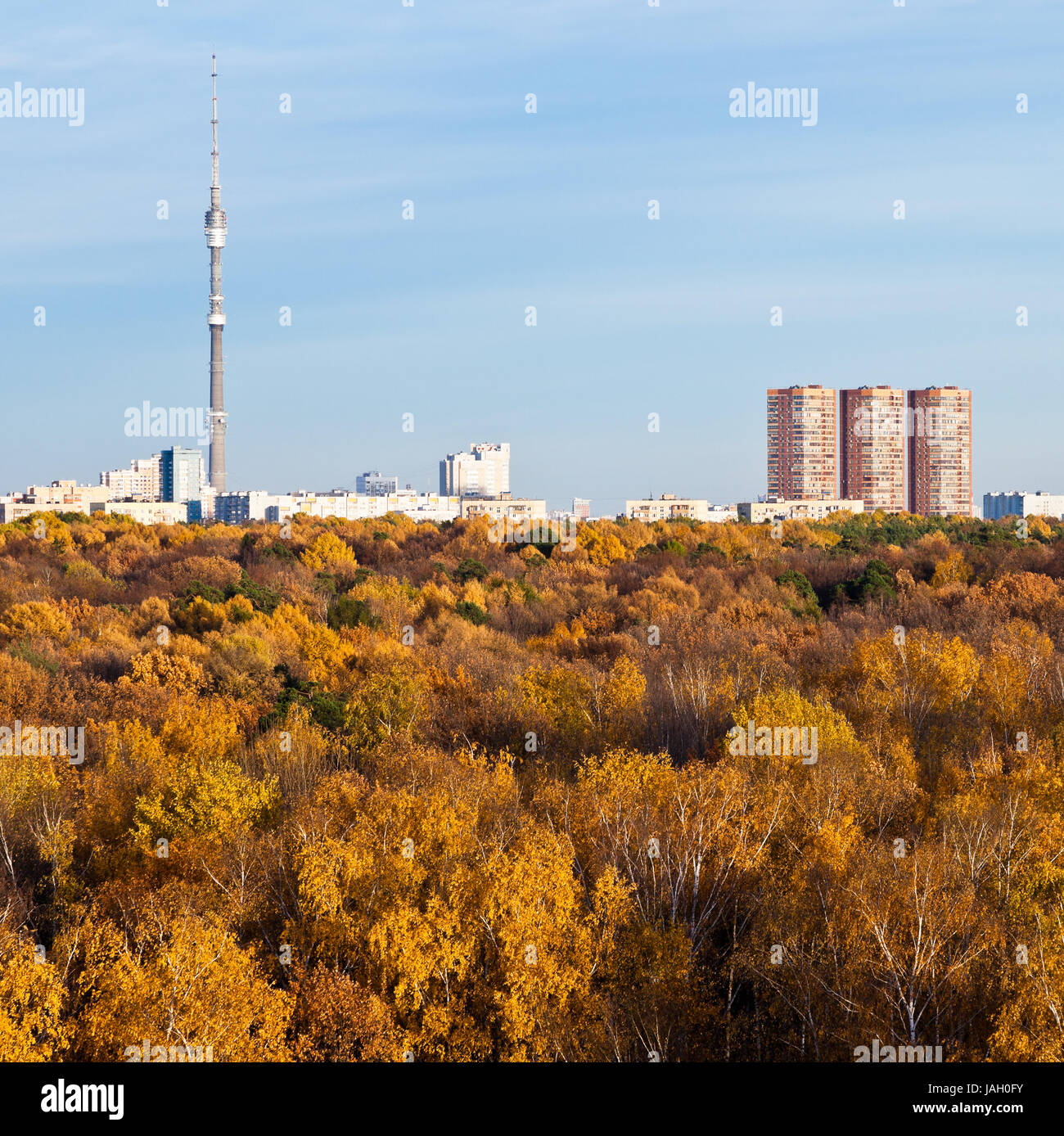 Moscow view with TV tower, houses and autumn trees and blue afternoon ...