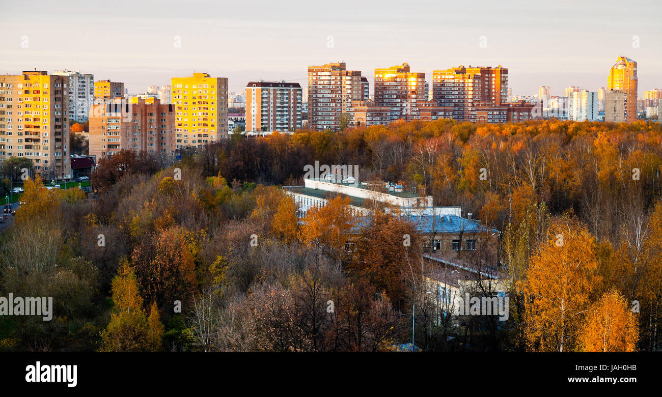 panoramic view of urban residential district in pink autumn sunset ...