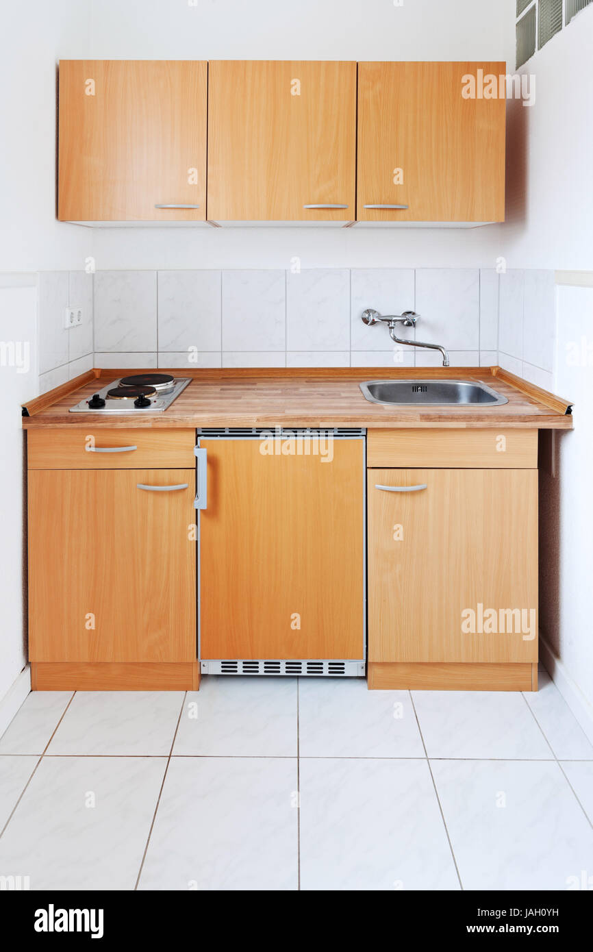 small kitchen with simple furniture set Stock Photo - Alamy