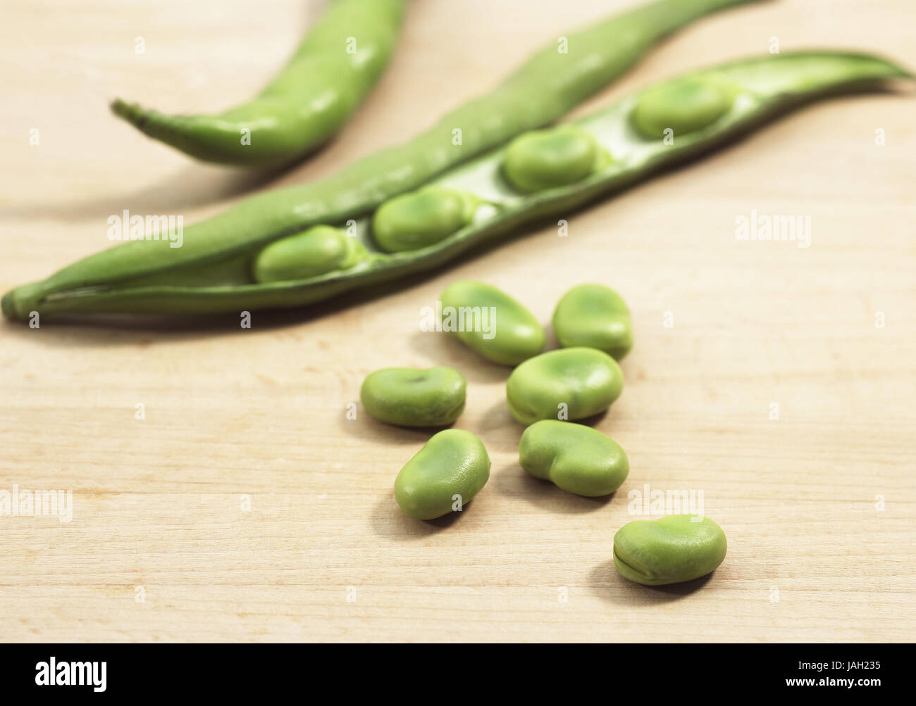 Fresh field beans on wooden springboard Stock Photo - Alamy