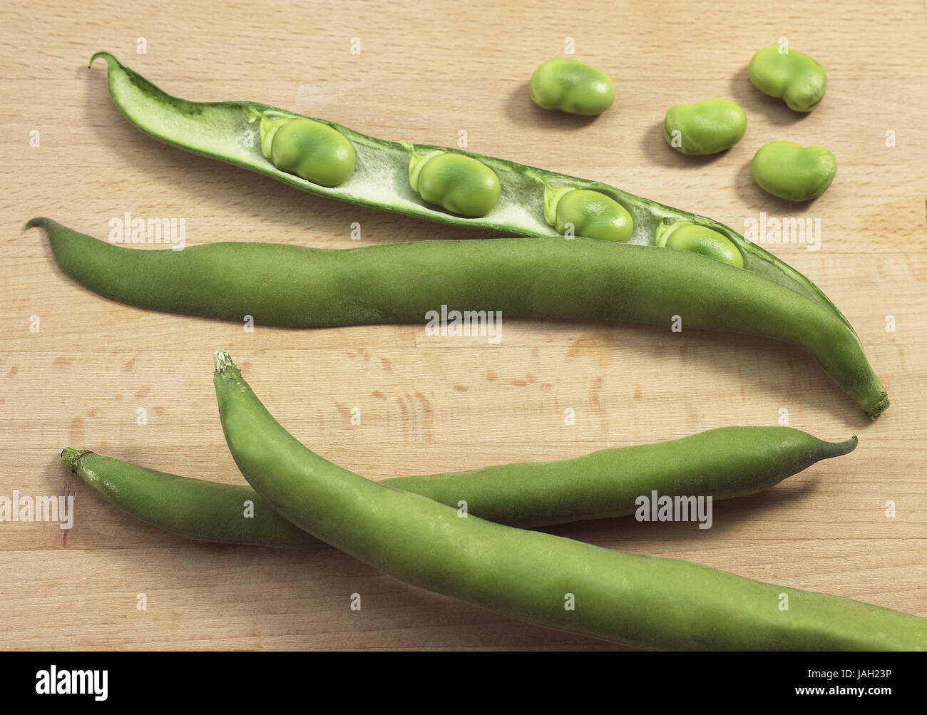 Fresh field beans on wooden springboard Stock Photo - Alamy