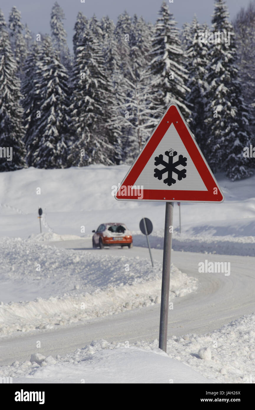 Road sign warns about snow and icy roads Stock Photo - Alamy