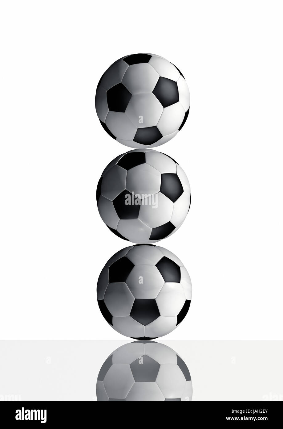 three footballs on white background Stock Photo - Alamy
