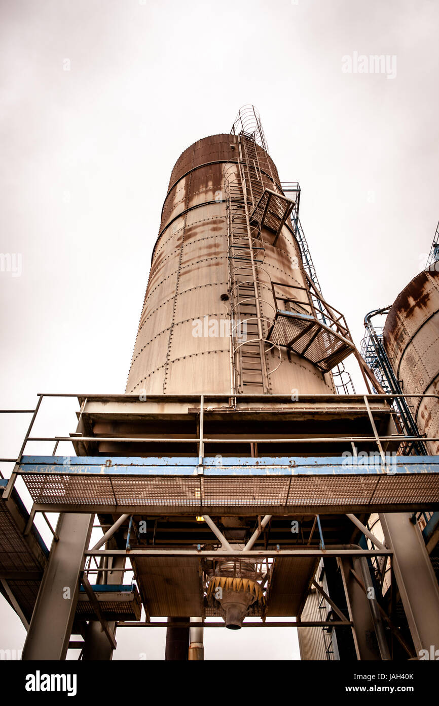 Industrial silos in a old rusty inviroment Stock Photo - Alamy
