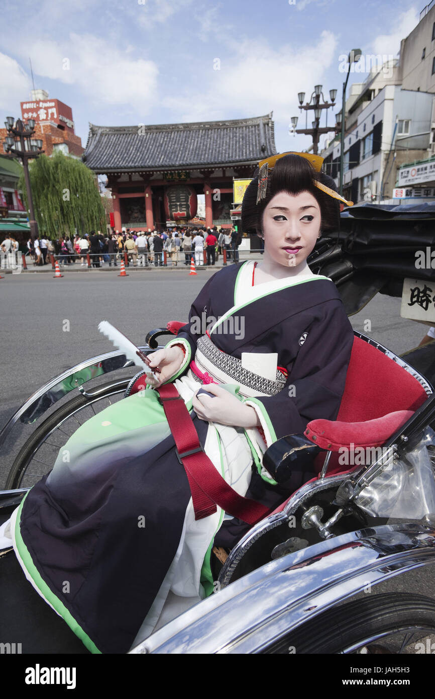 Japan,Tokyo,Asakusa,geisha in ricksha before the Asakusa Kannon temple ...