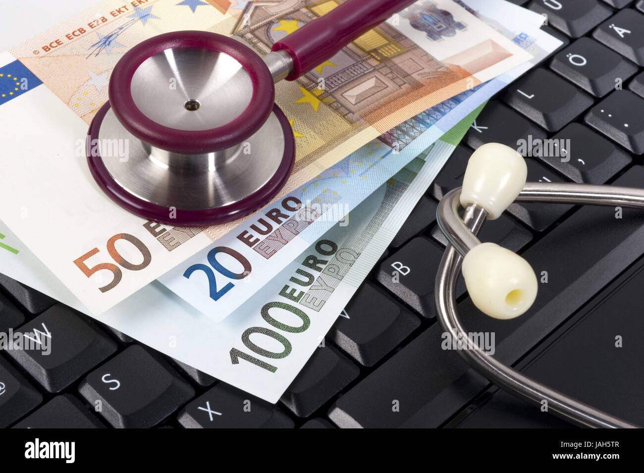 Euro of bank notes and stethoscope on computer keyboard hi-res stock ...