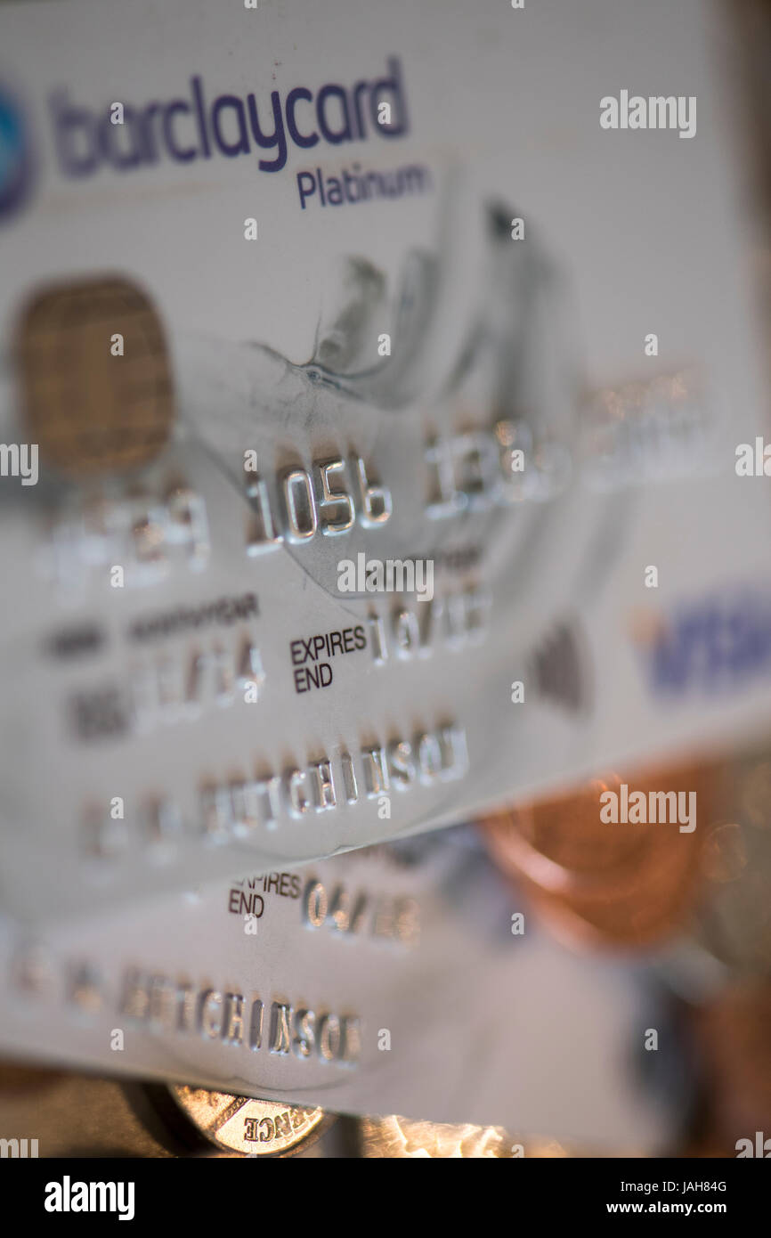 Chip and pin debit card amongst pile of cash Stock Photo - Alamy