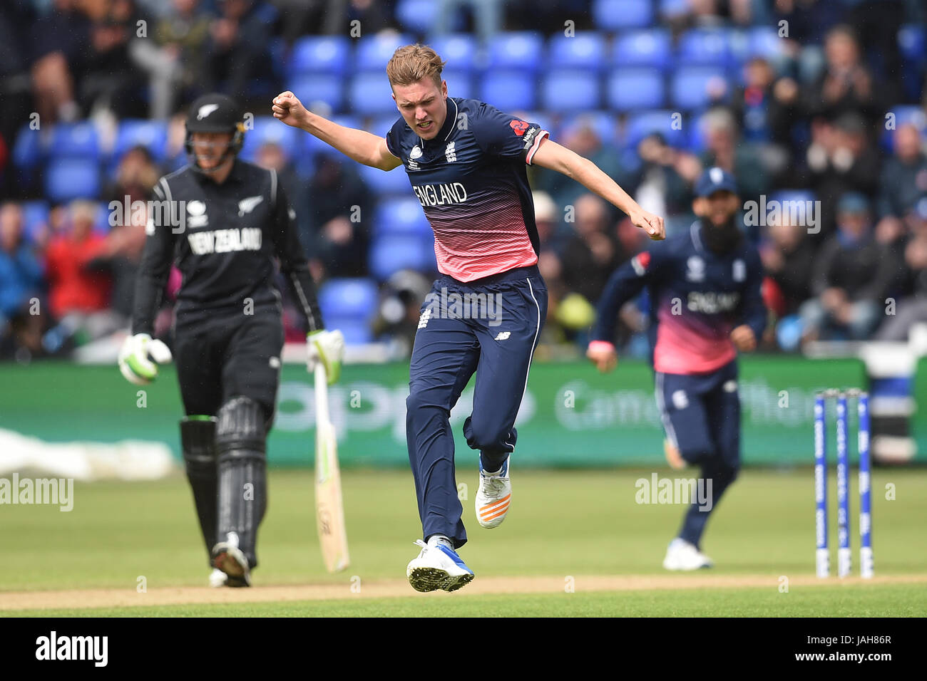 England's Jake Ball celebrates taking the wicket of New Zealand's Luke ...