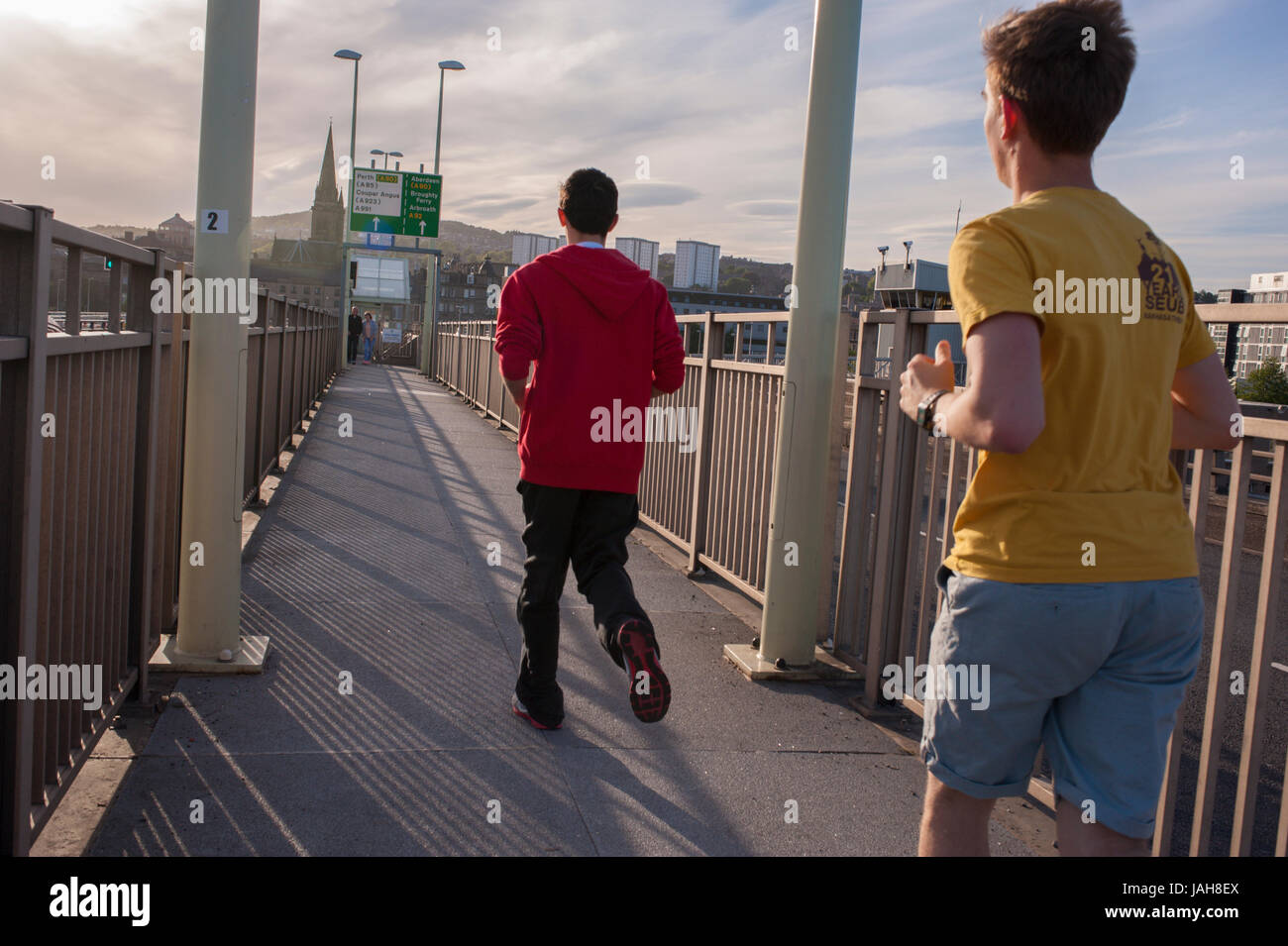People running on the Road Tay Bridge. Dundee, Scotland. Situated on ...