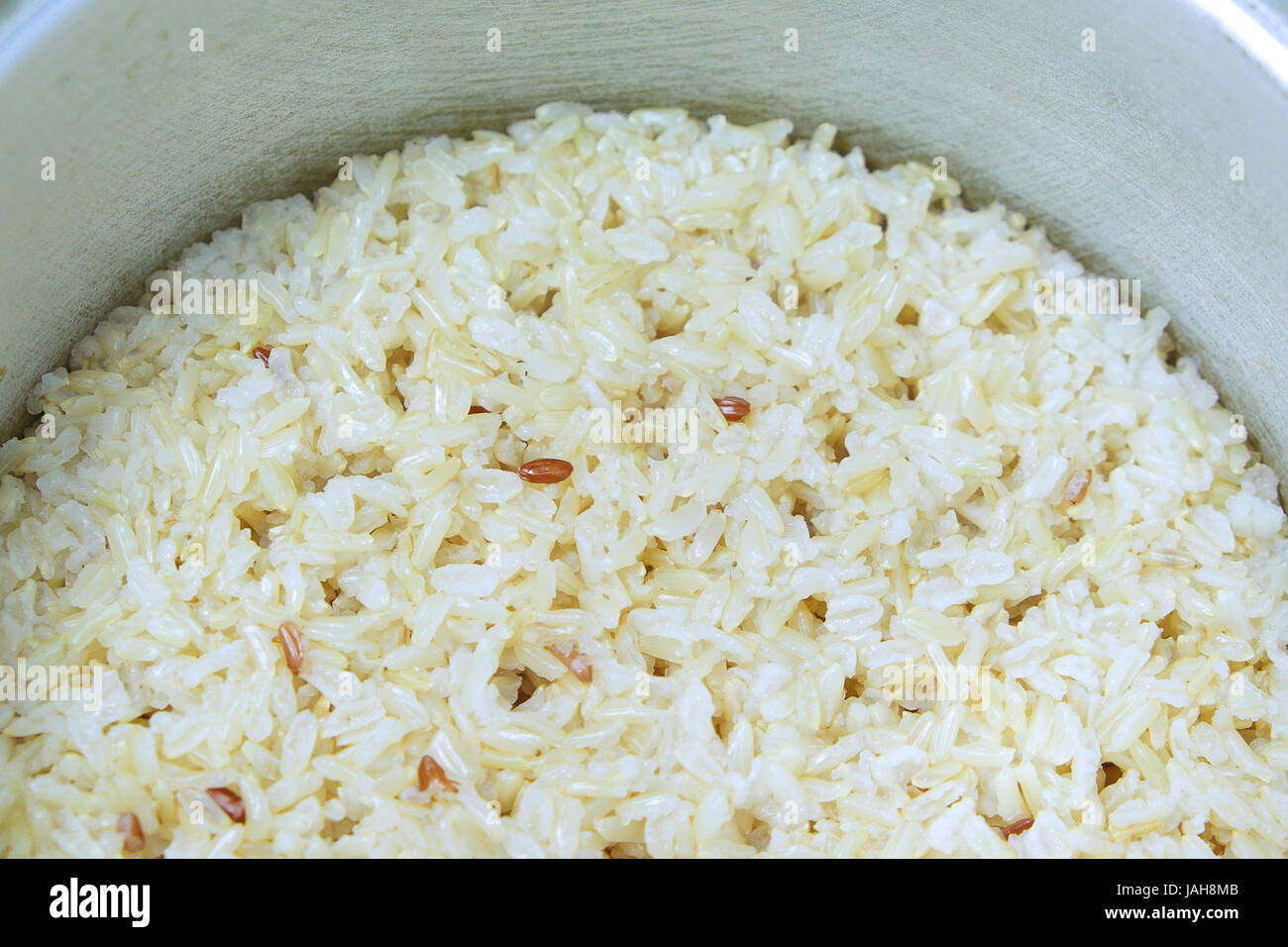 Cooked brown rice, hot in the pot Stock Photo - Alamy