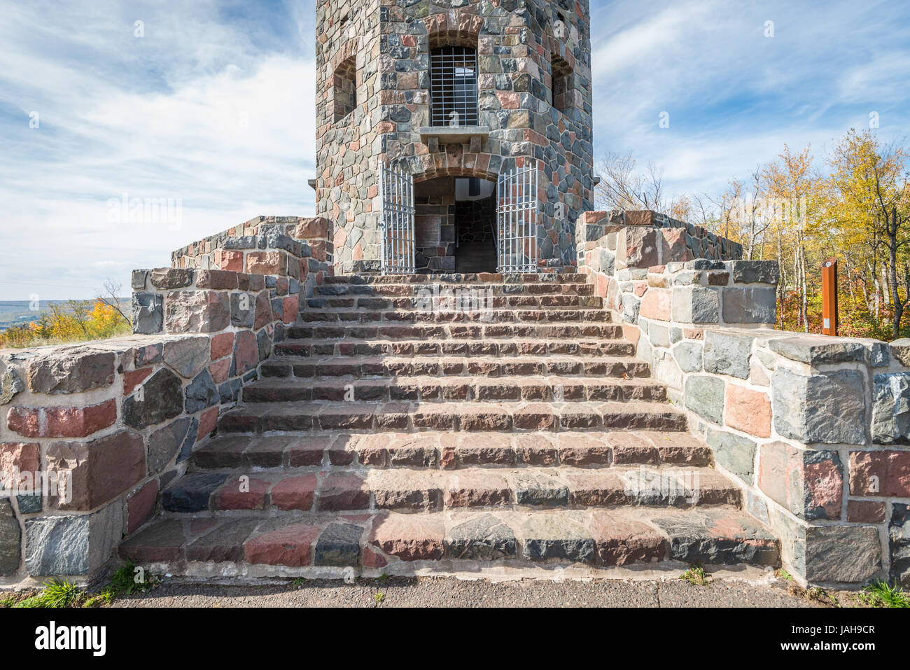 Front entrace of a stone tower during autumn time Stock Photo - Alamy