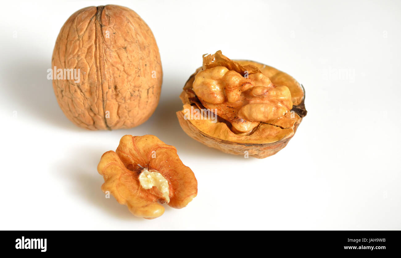 walnut and a cracked walnut isolated on the white background Stock ...