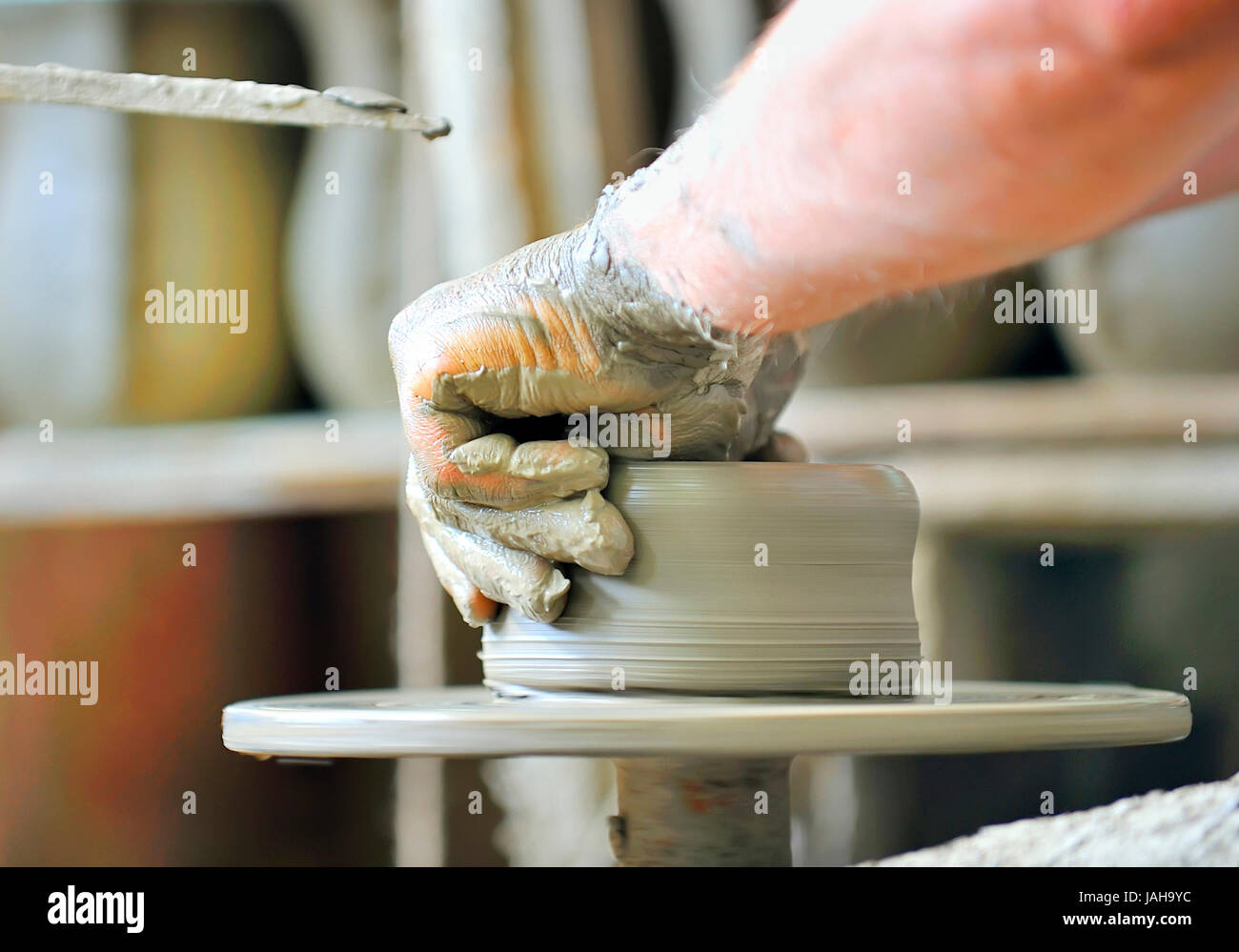 the creation of pottery on wheel Stock Photo - Alamy
