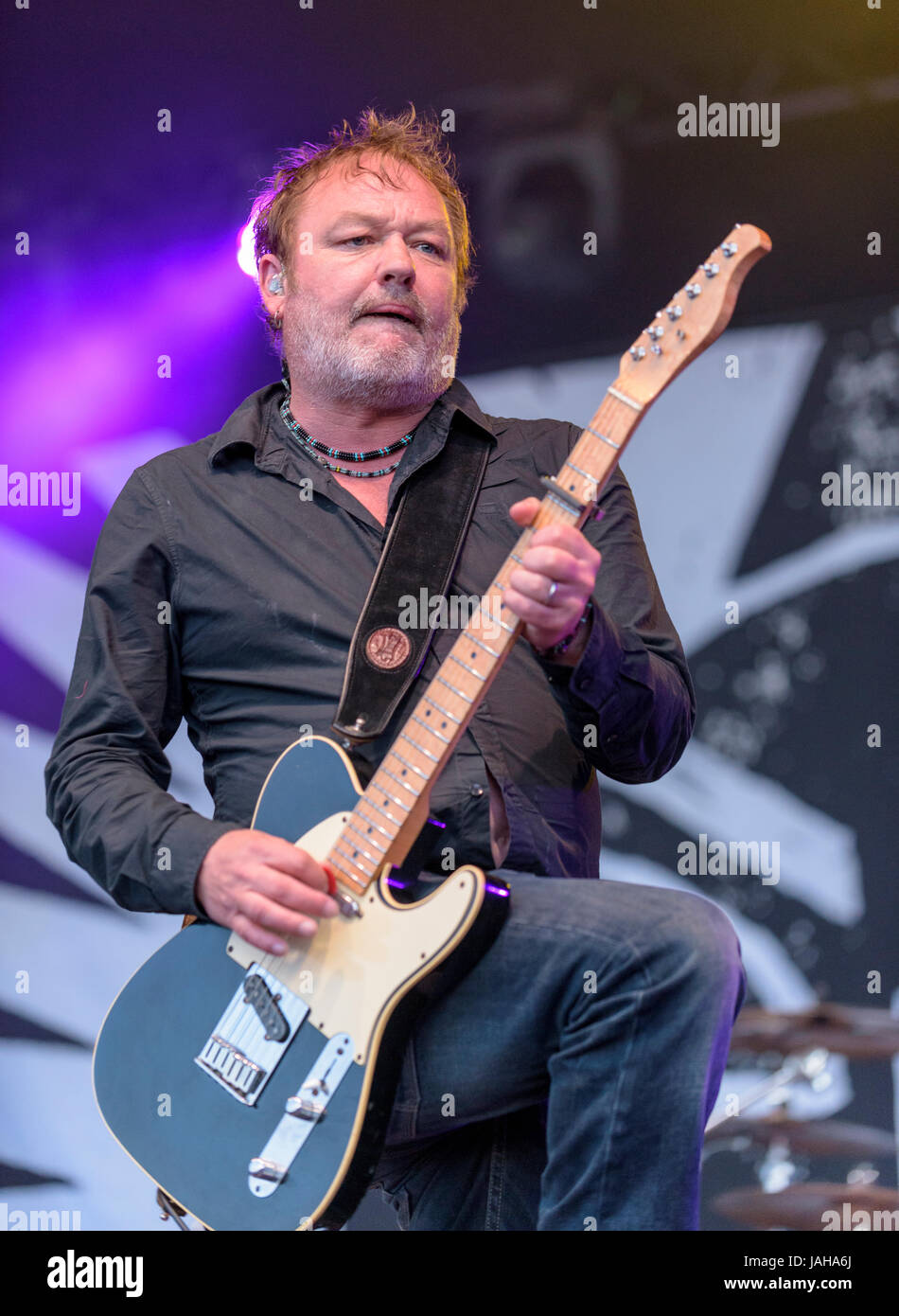 Mark Chadwick of The Levellers performing at Wychwood Festival ...