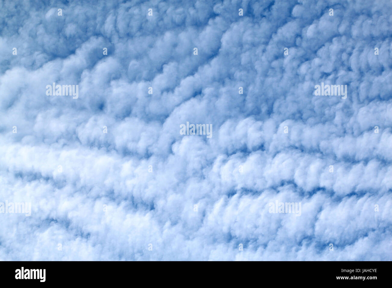 White feather clouds in the sky Stock Photo - Alamy