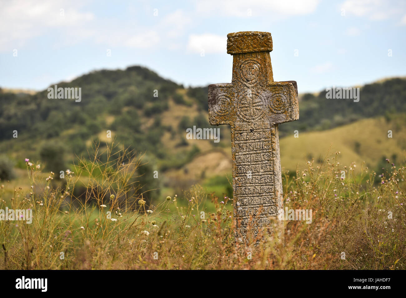 Ancient stone orthodox cross deserted on a plain Stock Photo - Alamy
