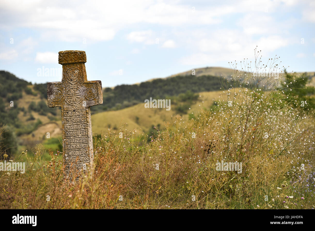 Ancient stone orthodox cross deserted on a plain Stock Photo - Alamy