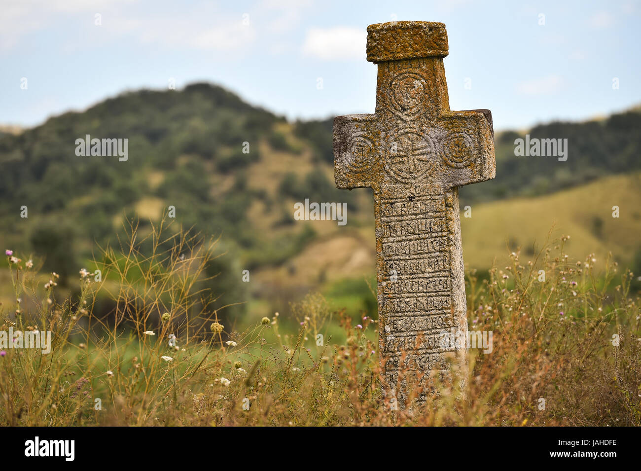 Ancient stone orthodox cross deserted on a plain Stock Photo - Alamy
