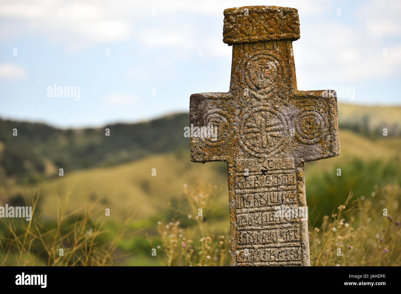 Ancient stone orthodox cross deserted on a plain Stock Photo - Alamy