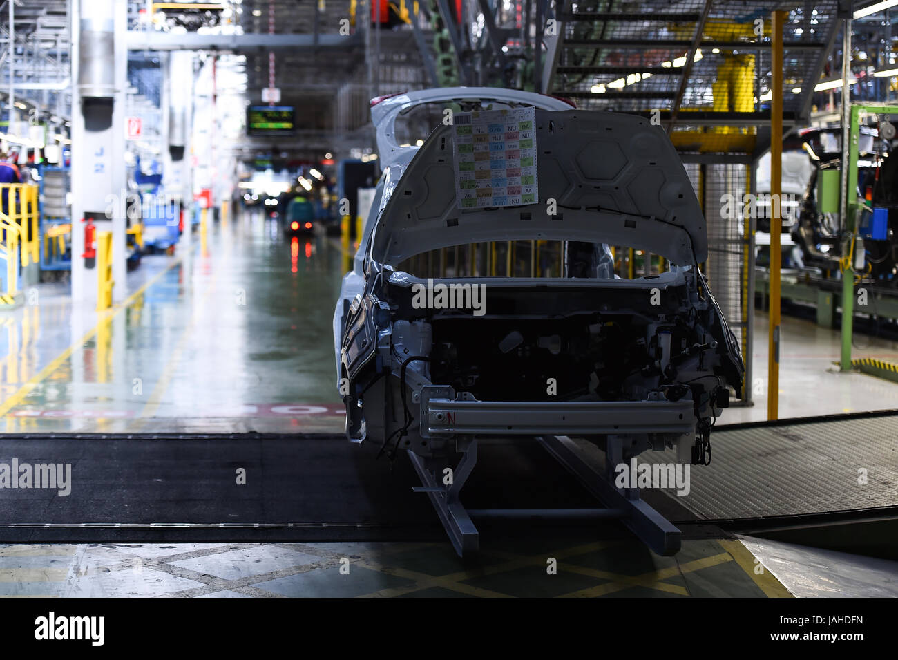 Car bodies on the production line inside automobile factory Stock Photo ...