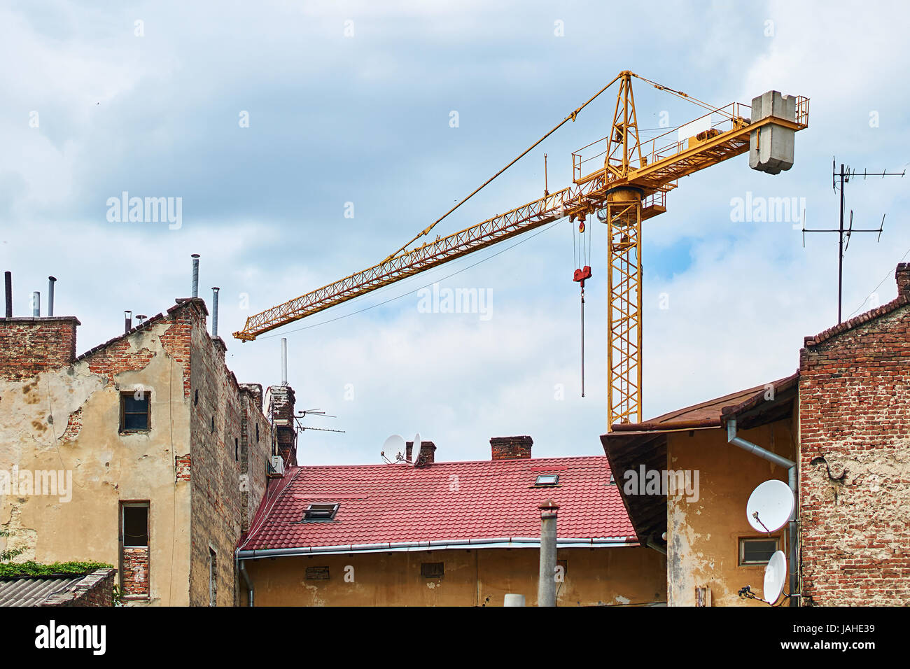 Building with crane in the old city Stock Photo - Alamy