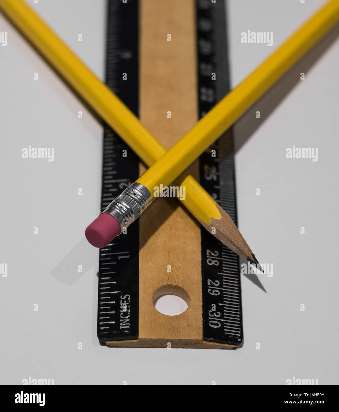 Pencils On Ruler Stock Photo - Alamy