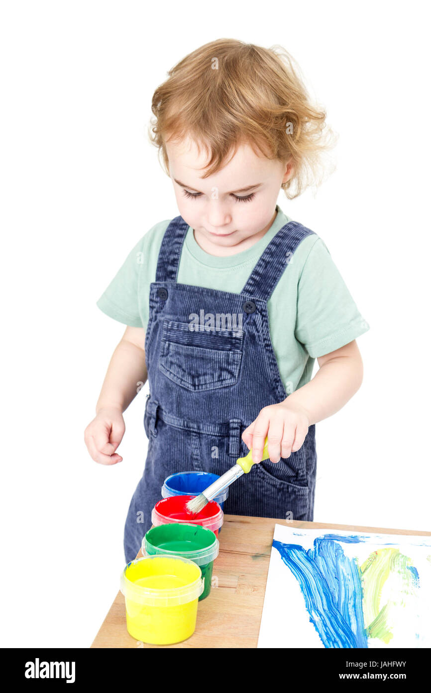 child with brush and paint isolated in white background Stock Photo - Alamy